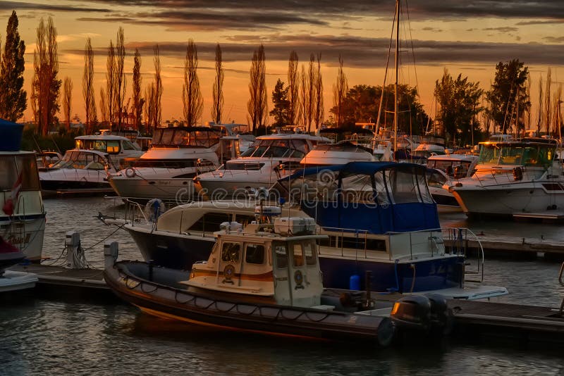 Marina at sunset editorial stock photo. Image of boats - 81879823