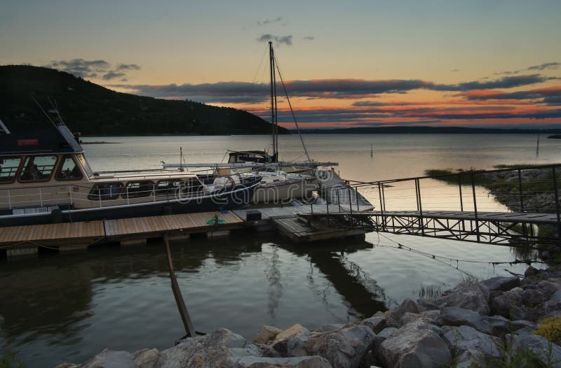 Marina at sunset stock photo. Image of visitors, boat - 90308424