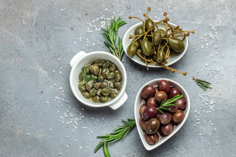 Marinated Capers Fresh Basil Leaves in a Small Bowl, on Gray Background ...