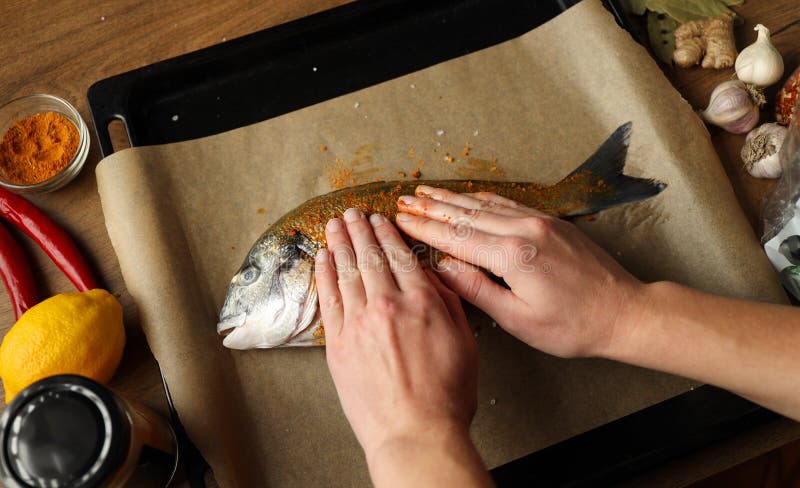 Marinated Fish with Hands in the Kitchen, Spices for Cooking Dorado ...