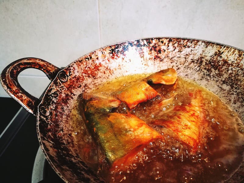 Marinated Fish with Seasoning is Fried in a Pan. Stock Image - Image of ...