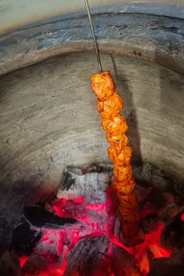 Marinated Fresh Meat Getting Cooked in the Tandoor Stock Image - Image ...