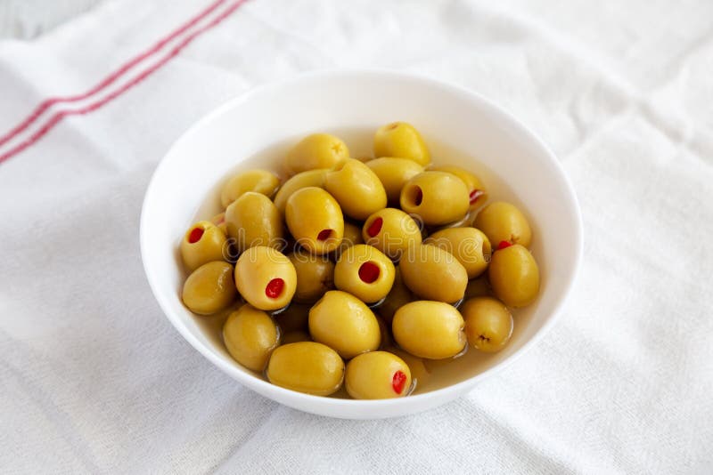 Marinated Green Olives with Pimento Peppers in a Bowl, Side View Stock ...