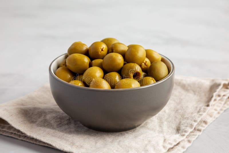 Green Pitted Olives in a White Plate. Olives Close-up Top View Stock ...