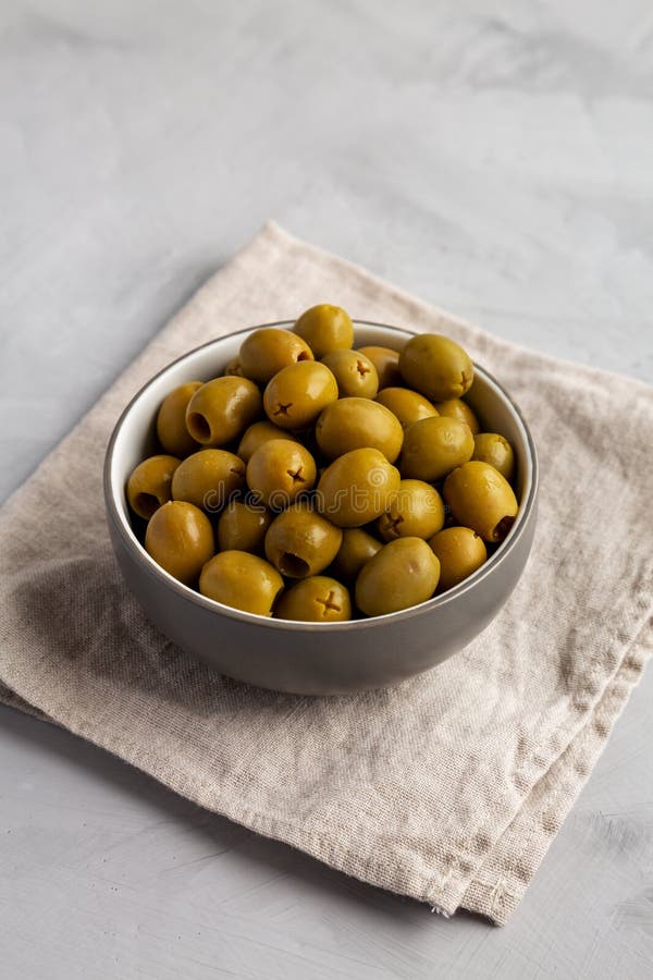 Marinated Green Pitted Olives in a Bowl, Side View Stock Image - Image ...