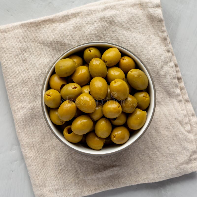 Marinated Green Pitted Olives in a Bowl, Top View. Flat Lay, Overhead ...