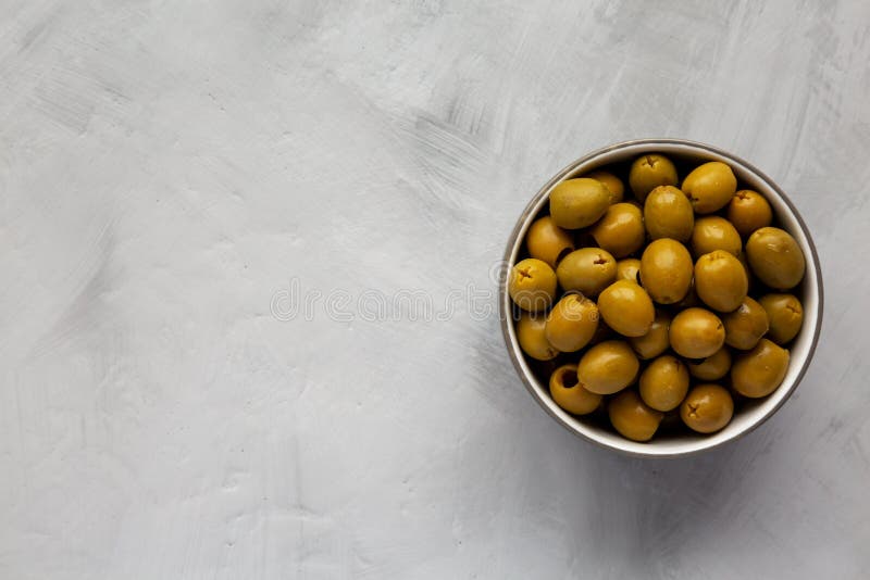 Green Pitted Olives in a White Plate. Olives Close-up Top View Stock ...