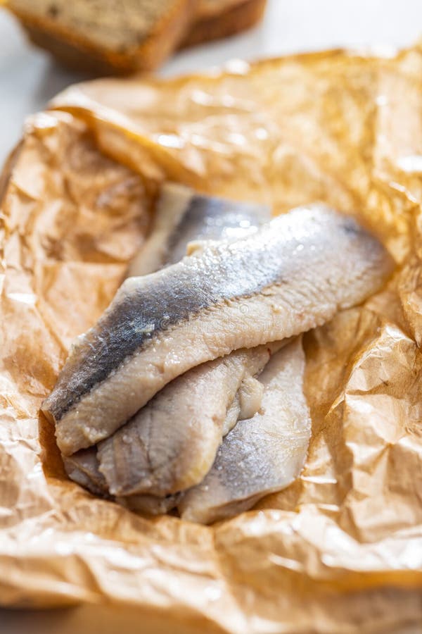 Marinated Herring Fish on Paper Stock Photo - Image of fishing, hering ...