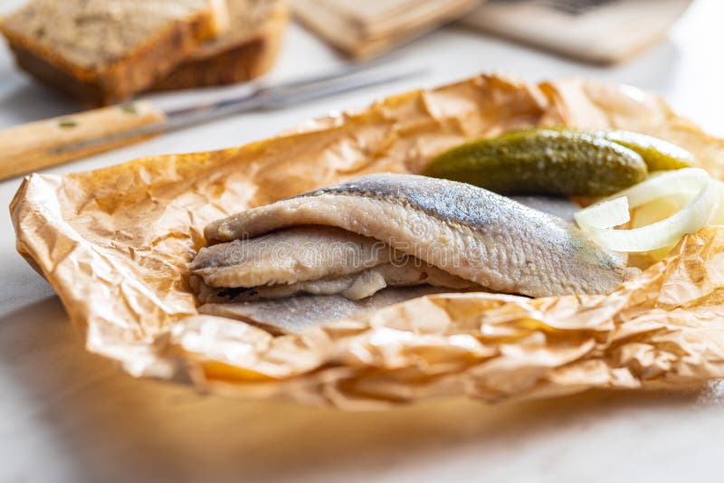 Marinated Herring Fish on Paper Stock Photo - Image of fishing ...