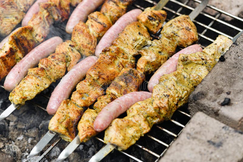 Marinated Meat with Grilled Sausages is Fried on a Fire Stock Image ...