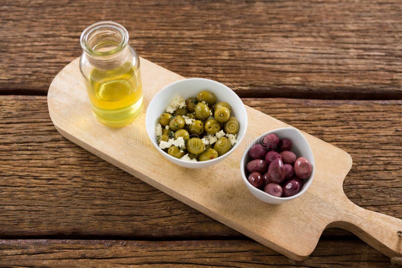 Marinated Olives in Bowl on Chopping Board Stock Photo - Image of ...