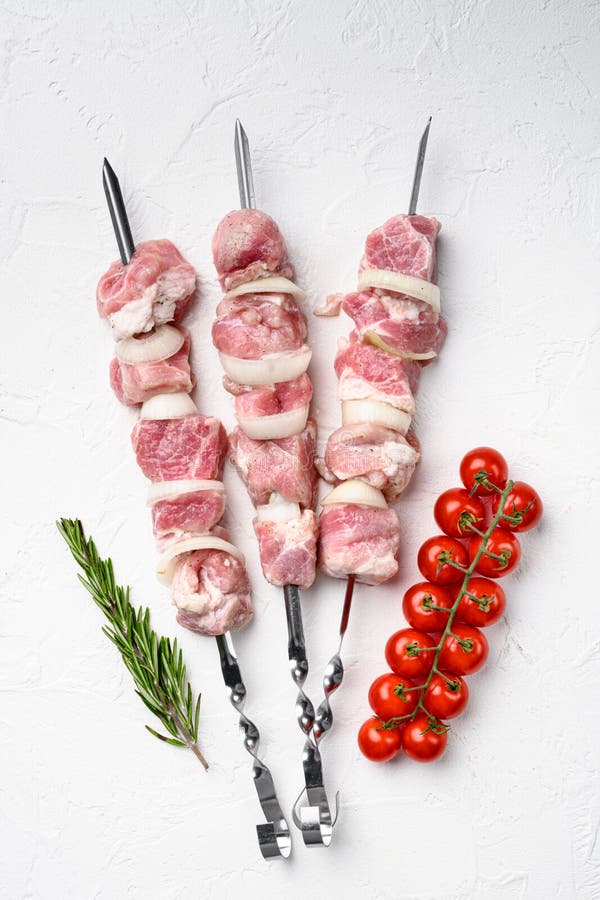 Marinated Raw Kebab on Skewers, Top View Flat Lay, on White Stone Table ...
