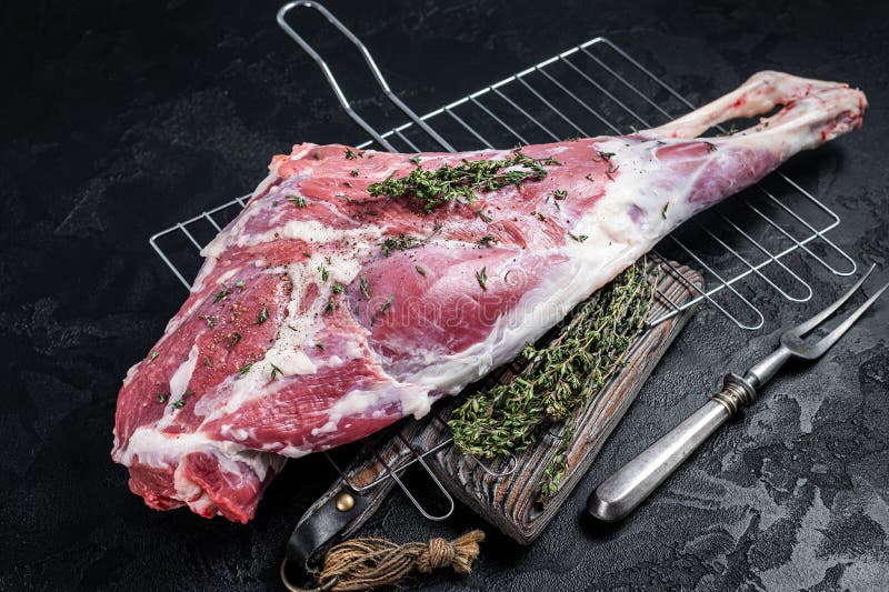 Raw Lamb Leg with Spices and Herbs on Marble Cutting Board. Dark ...