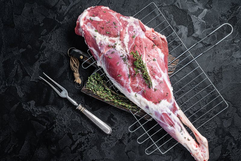 Marinated Raw Lamb Mutton Leg Thigh with Thyme and Spices. Black ...