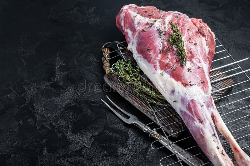 Marinated Raw Lamb Mutton Leg Thigh with Thyme and Spices. Black ...
