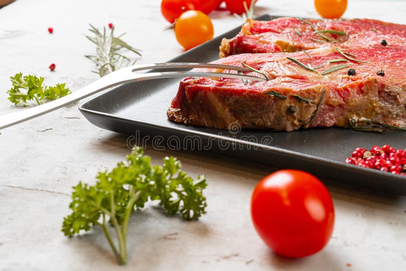 Marinated Raw Steaks on Stone Table with Spices Stock Image - Image of ...