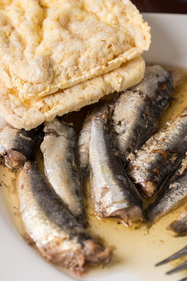Marinated Sardines in the Oil Served with Corn Bread Stock Photo ...