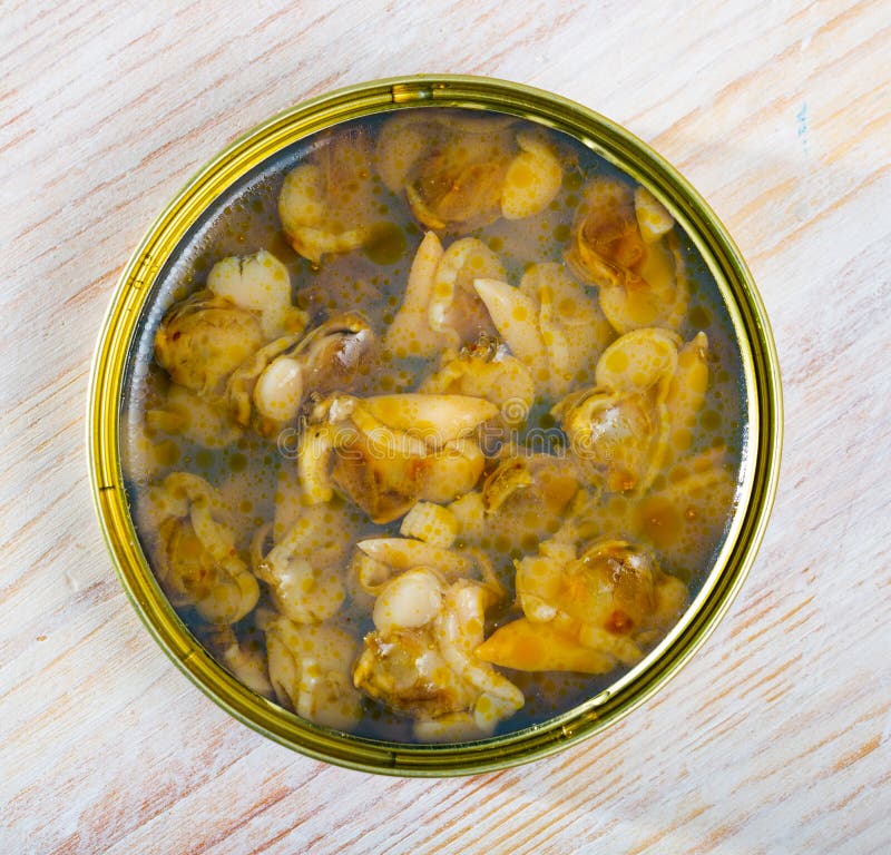 Marinated Shellfish in an Open Tin Can on Wooden Table Stock Photo ...