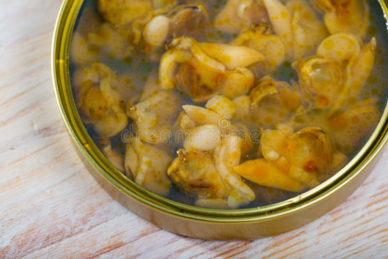 Marinated Shellfish in an Open Tin Can on Wooden Table Stock Image ...