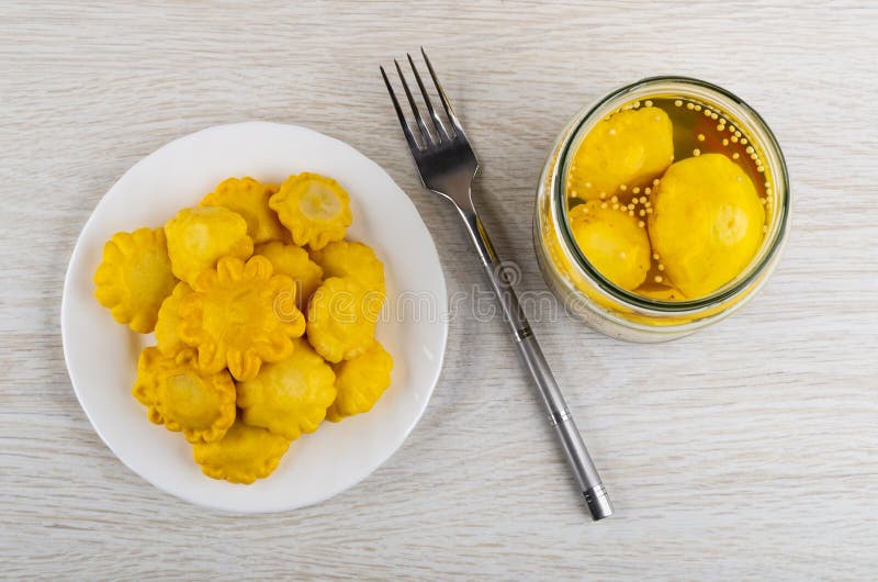 Marinated Squash in Plate, Jar with Squash, Fork on Table. Top View ...