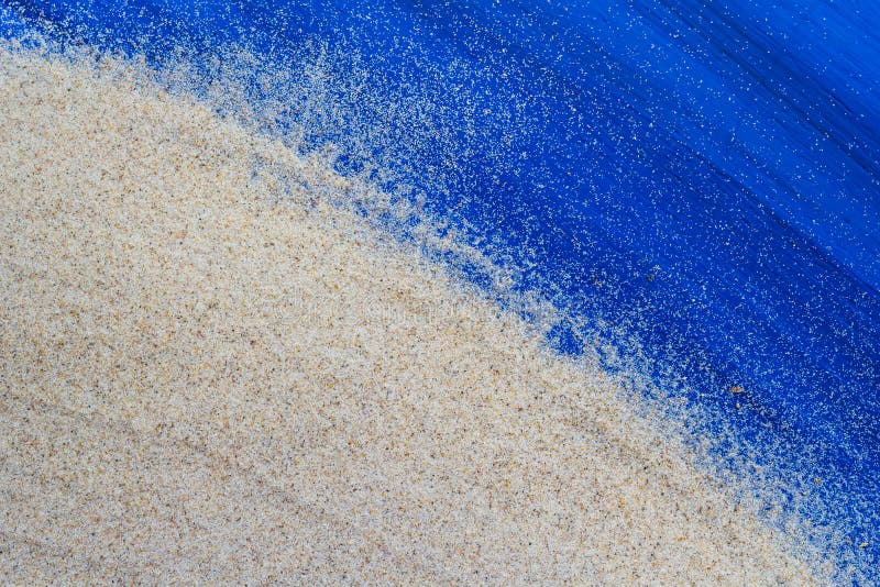 Sand Spilled Out Of A Transparent Glass Beaker. There Are Multicolored ...