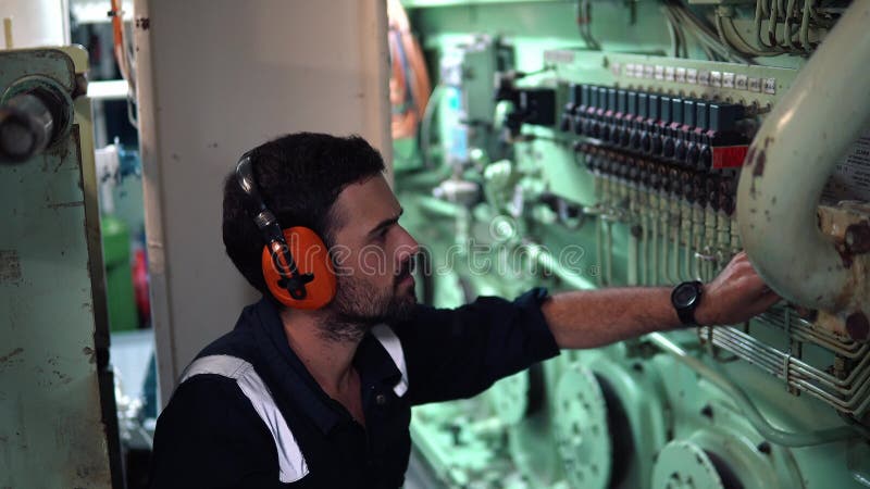 Marine Engineer Inspecting Ship`s Engine in Engine Control Room Stock ...