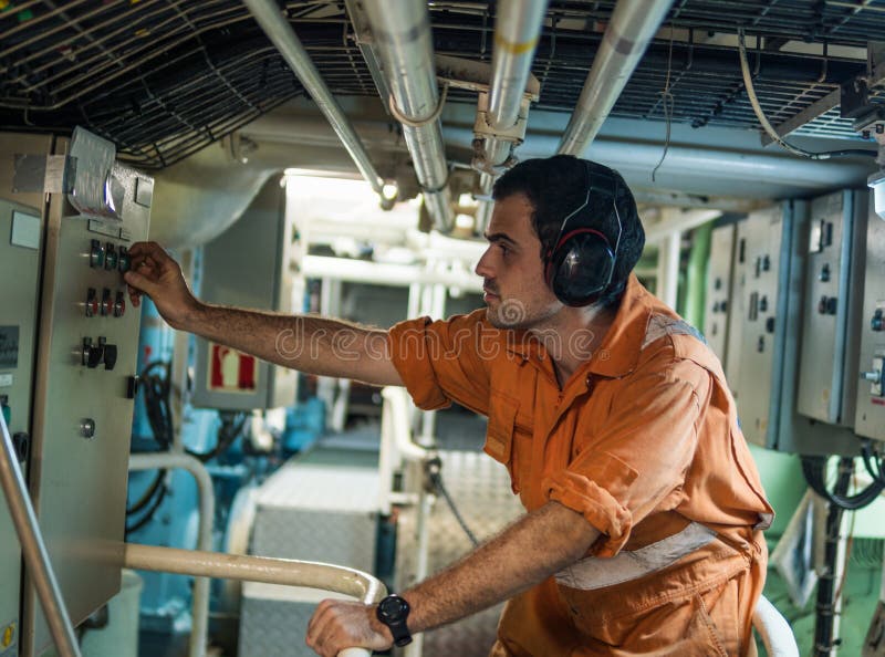 Marine Engineer Inspecting Ship`s Engine in Engine Control Room Stock ...