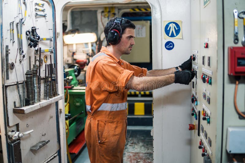 Marine Engineer Officer Controlling Vessel Engines in Engine Control ...