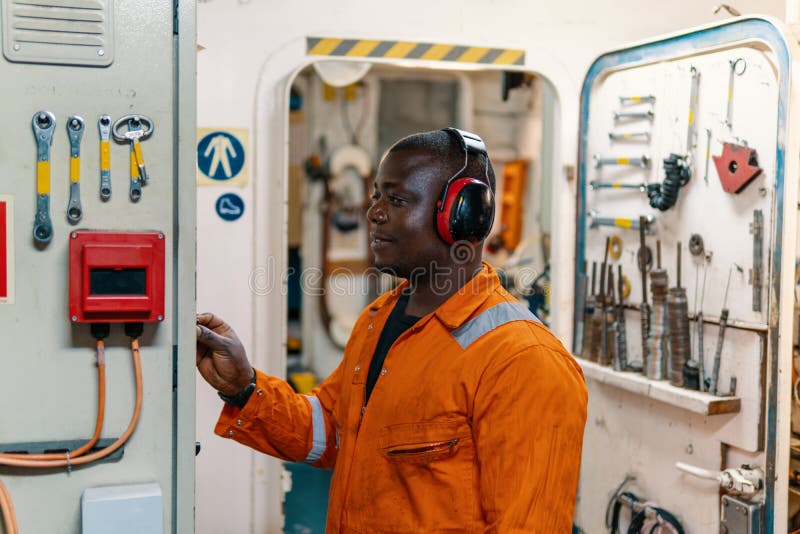 Marine Engineer Officer Working in Engine Room Stock Photo - Image of ...