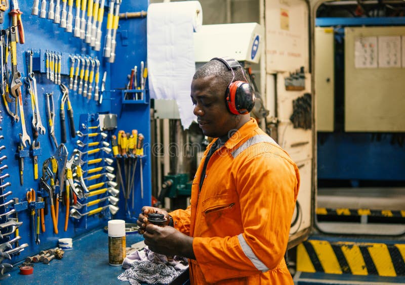 Marine Engineer Officer Working in Engine Room Stock Image - Image of ...