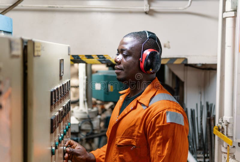 Marine Engineer Officer Working in Engine Room Stock Image - Image of ...