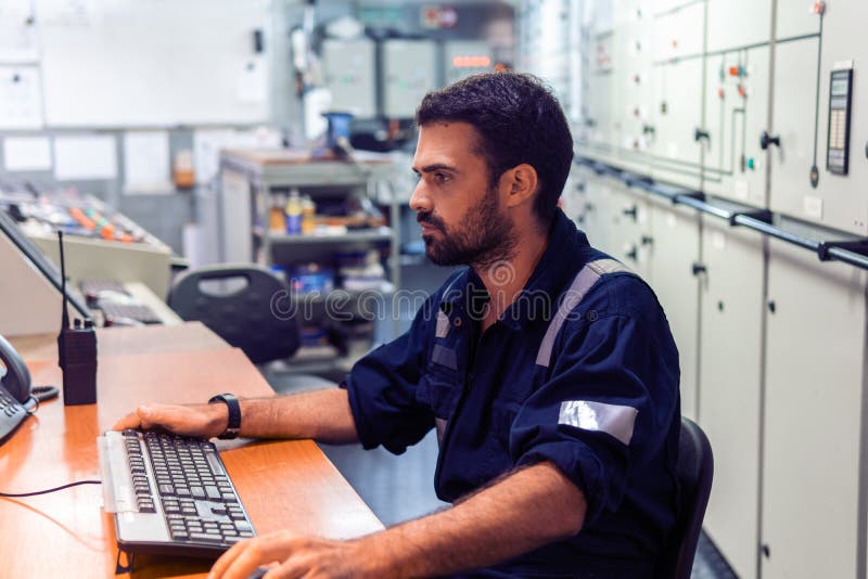 Marine Engineer Officer Working in Engine Room Stock Photo - Image of ...