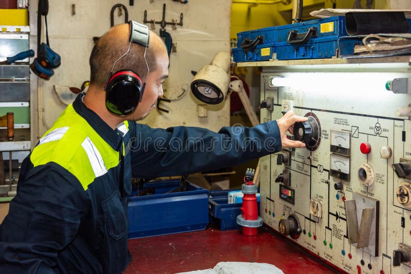 A Marine Engineer Stands at a Testing Station for Electrical and ...