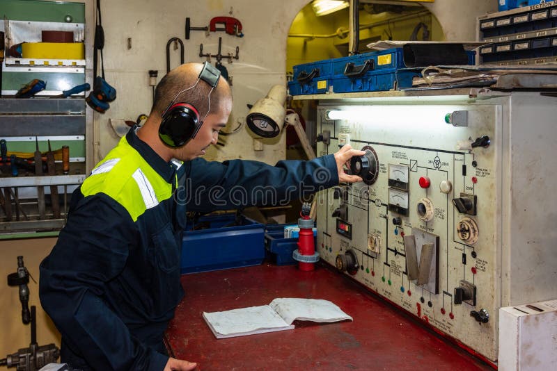 A Marine Engineer Stands at a Testing Station for Electrical and ...