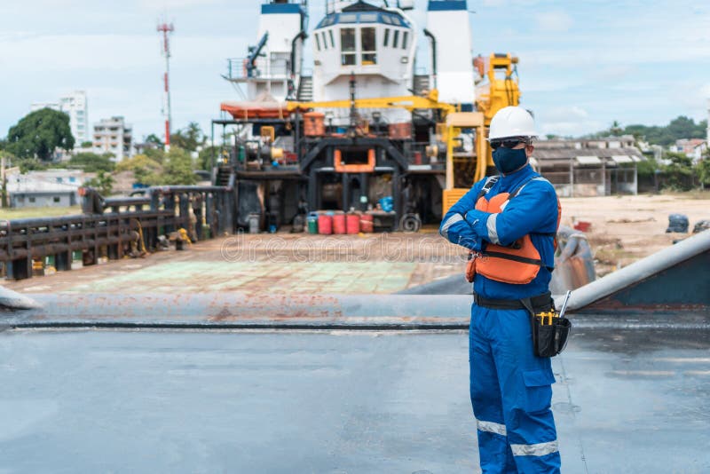Marine Engineering Officer on the Deck of a Ship. Sailor`s Work Stock ...