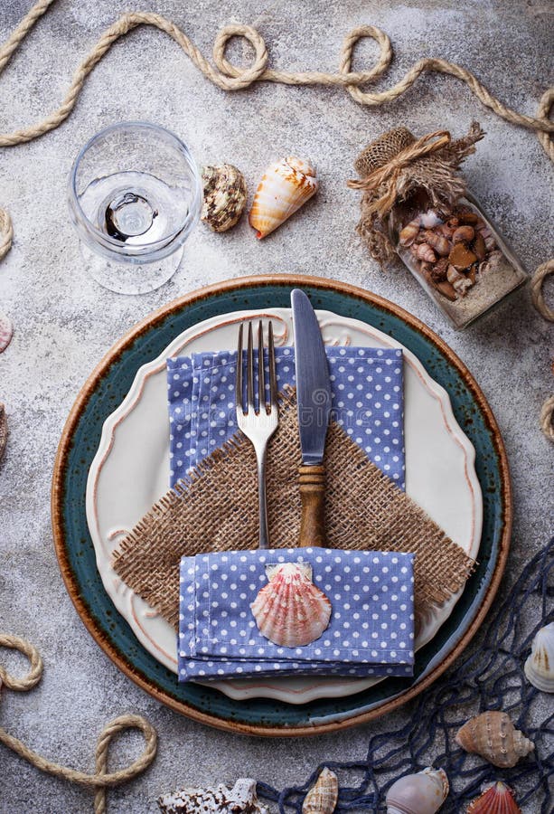 Marine Style Table Setting with Sea Shells, Fishnet and Rope Stock ...