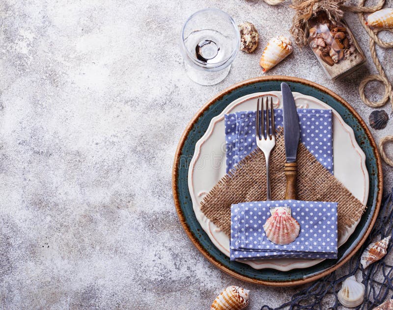 Marine Style Table Setting with Sea Shells, Fishnet and Rope Stock ...
