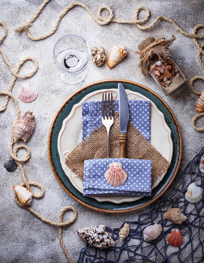 Marine Style Table Setting with Sea Shells, Fishnet and Rope Stock ...