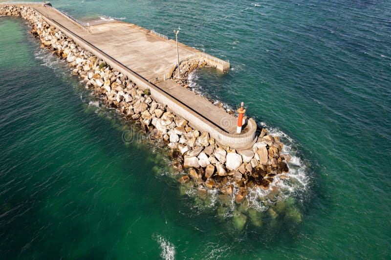 Breakwater with Lighthouse As a Guide for Maritime Navigation.Aerial ...