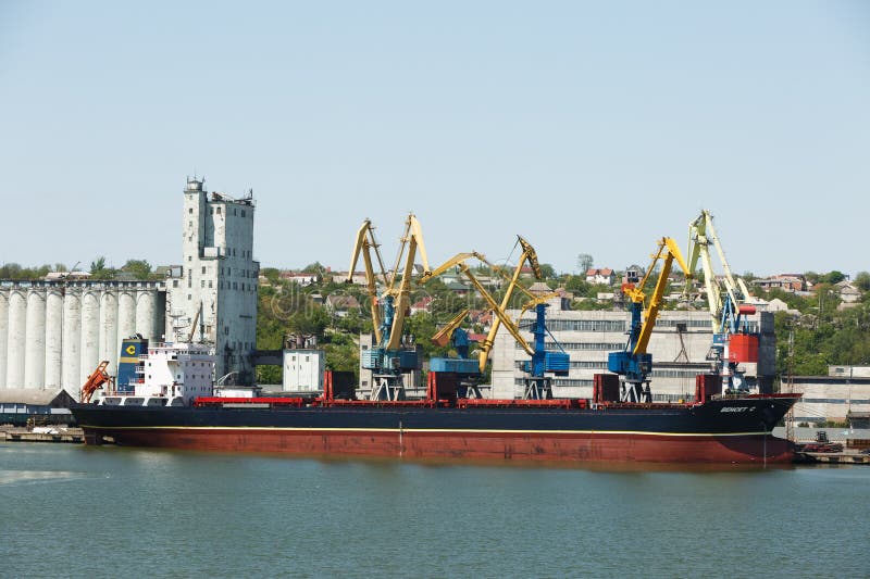 Cargo Ship Docked at Industrial Port. Maritime Vessel Loading ...