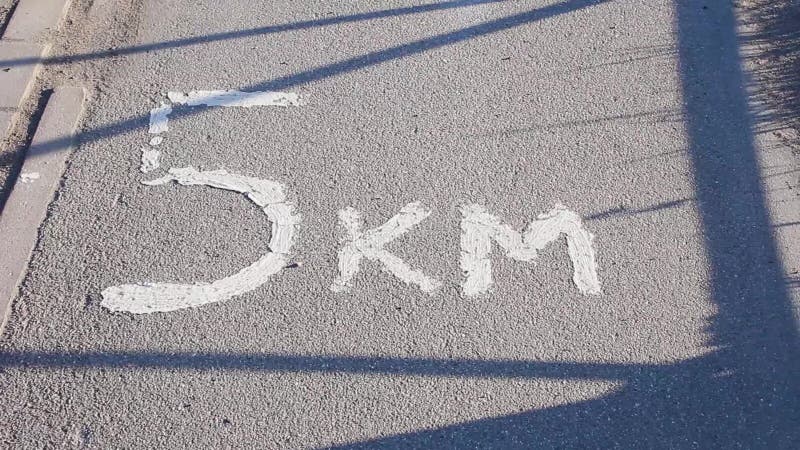 Mark on the Pavement 5 Kilometers Distance Racetrack Stock Footage ...