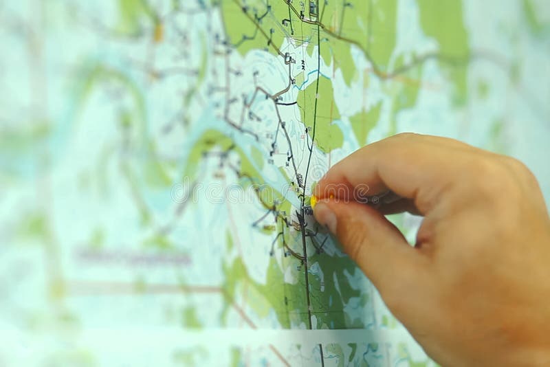 Mark a Point on the Map with Your Hand. Topographic Stock Photo - Image ...