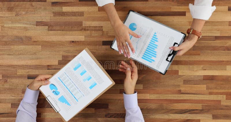 Marketers Study Customers Activity Graphs at Table Stock Footage ...