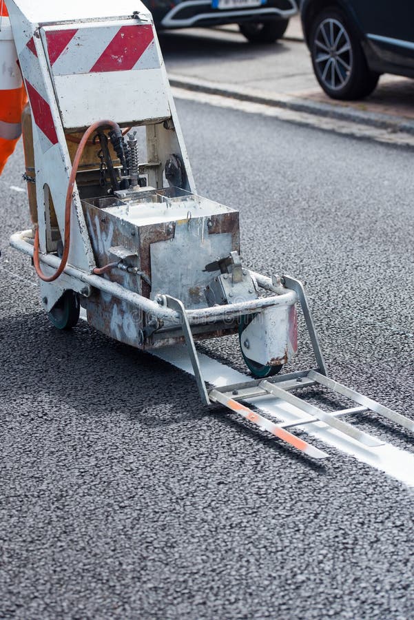 Road Marking Applicator Worker in Action in the Middle of a Road Stock ...