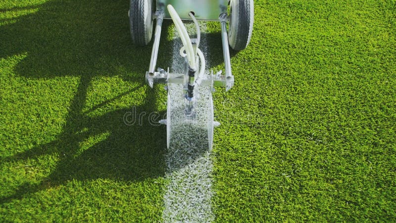 Marking Football Stadium Field Using a Professional Paint Machine Stock ...