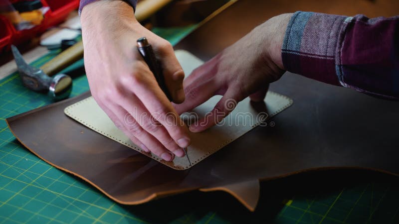 Marking Leather for Crafting Using a Template and Awl Stock Footage ...