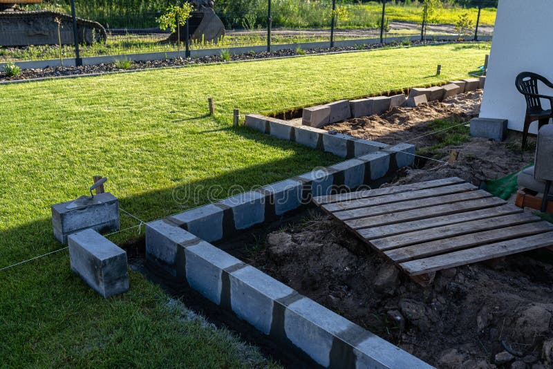 Marking Out Concrete Block Foundations Terrace Behind House Using ...