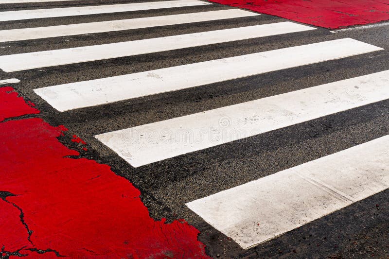 Markings of Crosswalks and Red Rubber on the Road Stock Photo - Image ...