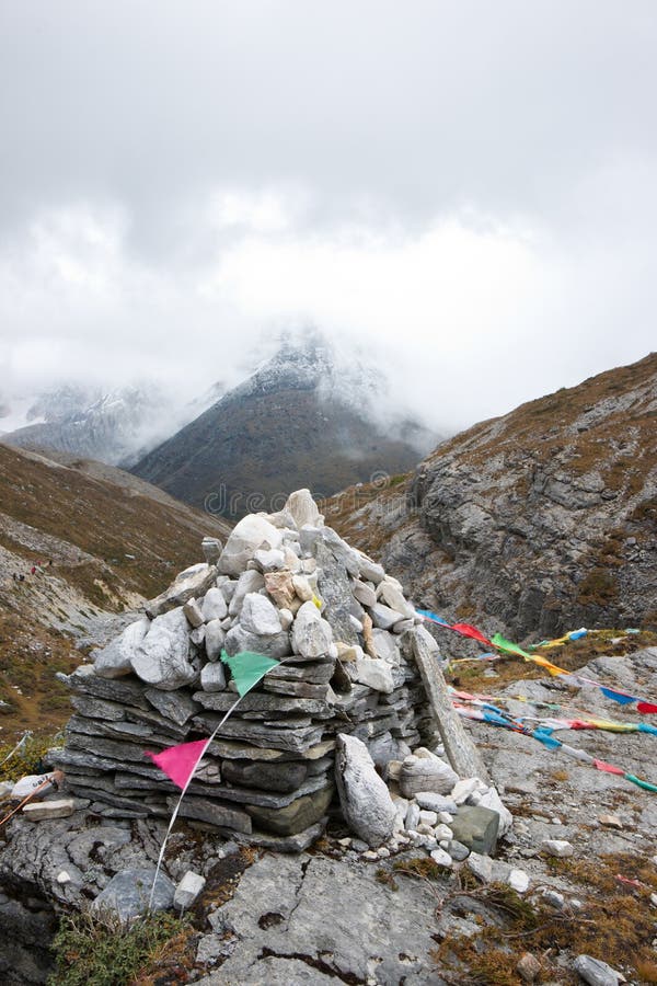 Marnyi Stone Stack With Snow Mountain In Fog Stock Photo - Image of ...