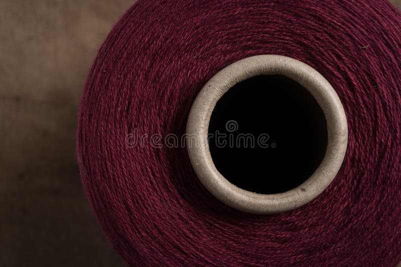 Maroon Thread Spool Hole stock photo. Image of yarn, wool - 68653458